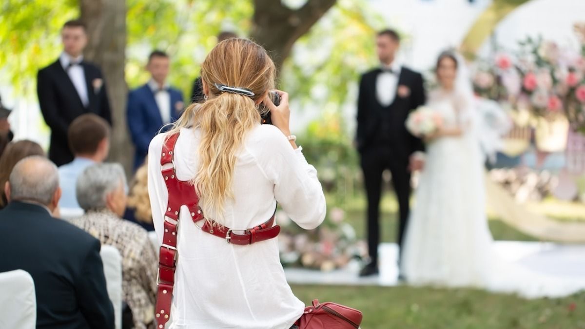 Photographer asks wedding guest to leave, 'stay out of my way.' 'I am ...